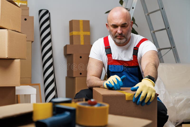 Man Mover in Uniform Packing Boxes for Relocation Stock Image - Image ...