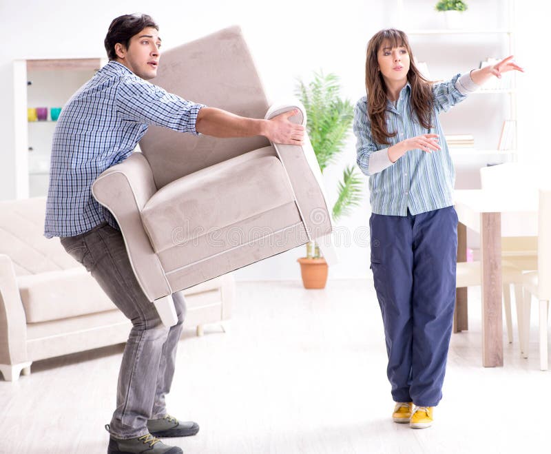 Man Moving Armchair in the Living Room Stock Image - Image of house ...