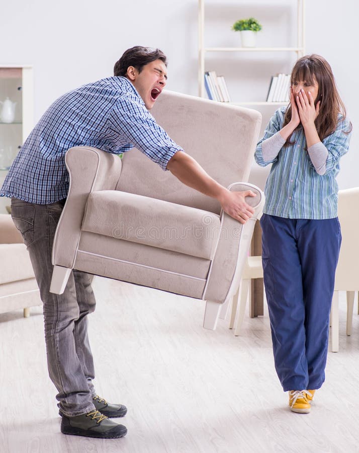 Man Moving Armchair in the Living Room Stock Photo - Image of furniture ...