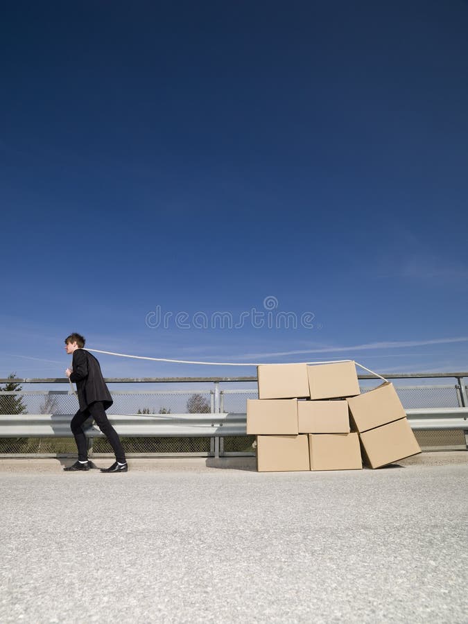 Man with Moving Boxes stock image. Image of land, confidence - 13956123