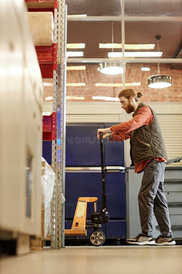 Man Moving Boxes in Warehouse Side View Stock Image - Image of ...