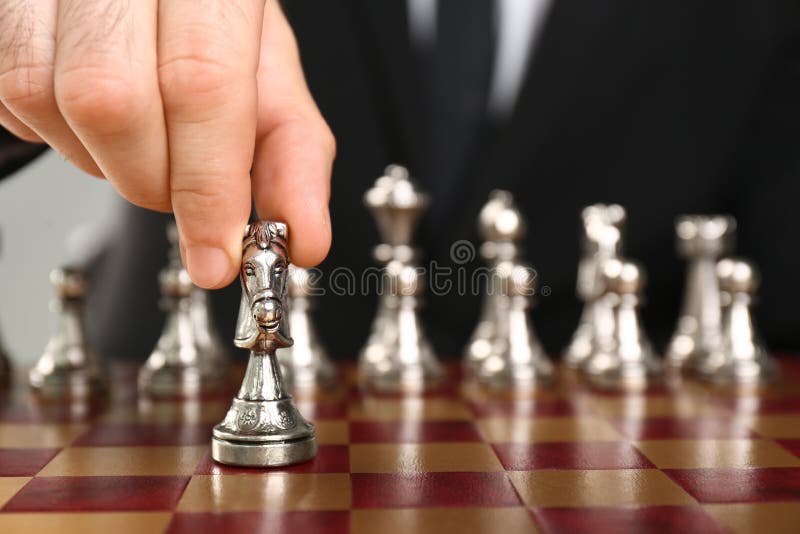 Man Moving Chess Piece on Board, Closeup Stock Photo - Image of ...