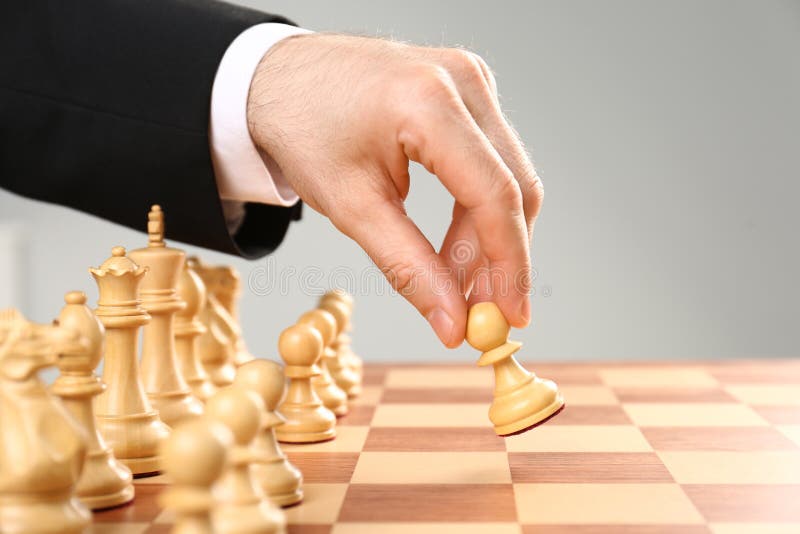 Man Moving Chess Piece on Board, Closeup Stock Photo - Image of matter ...