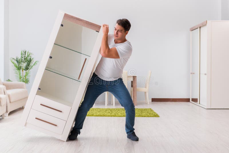 The Man Moving Furniture at Home Stock Image - Image of dresser ...