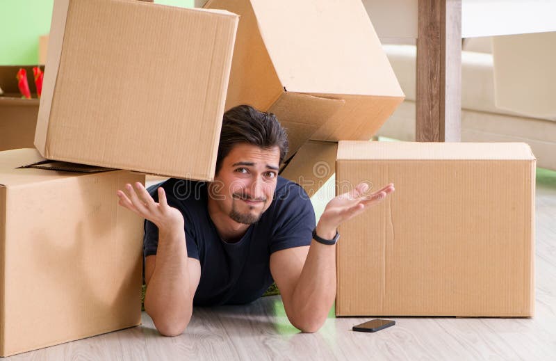 Man Moving House with Boxes Stock Photo - Image of packaging, mortgage ...