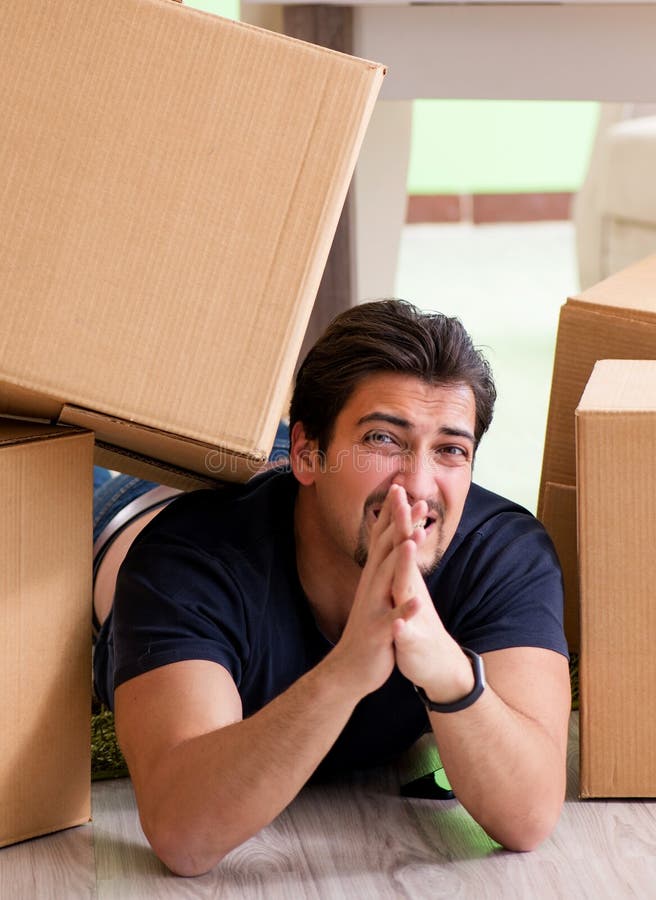 Man Moving House with Boxes Stock Image - Image of movers, case: 227680725
