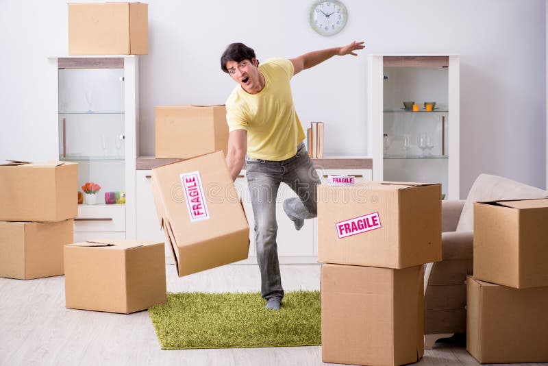 The Man Moving House and Relocating with Fragile Items Stock Photo ...