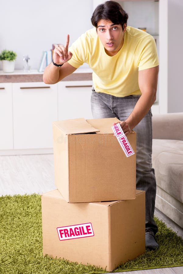 The Man Moving House and Relocating with Fragile Items Stock Photo ...