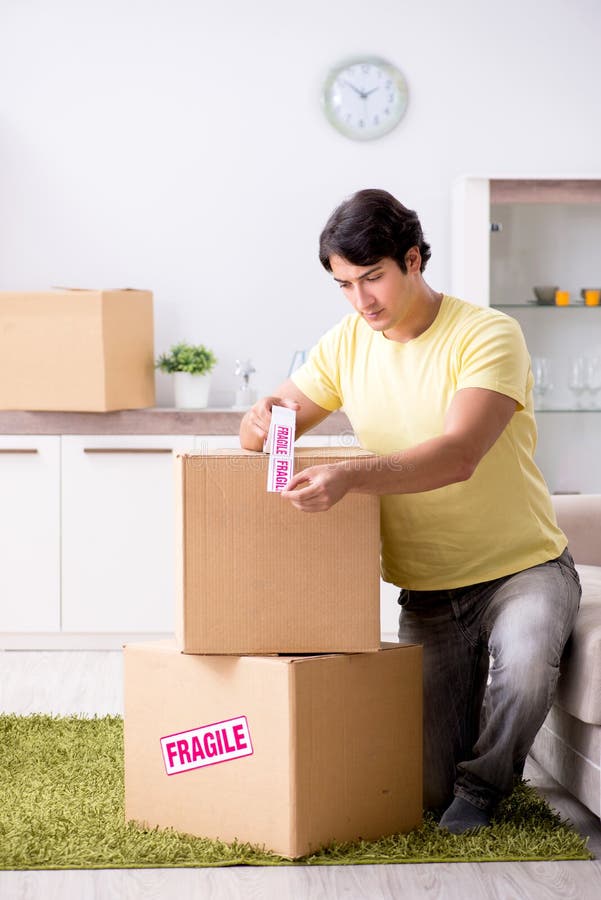 The Man Moving House and Relocating with Fragile Items Stock Image ...