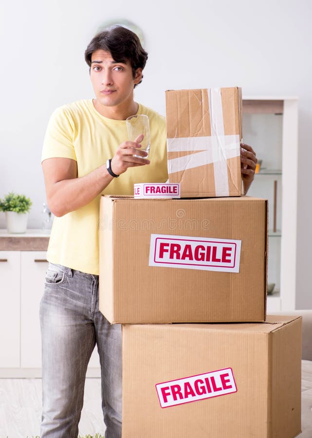Man Moving House and Relocating with Fragile Items Stock Image - Image ...