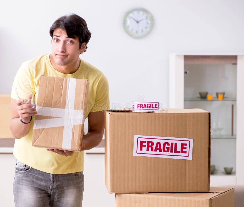 Man Moving House and Relocating with Fragile Items Stock Image - Image ...
