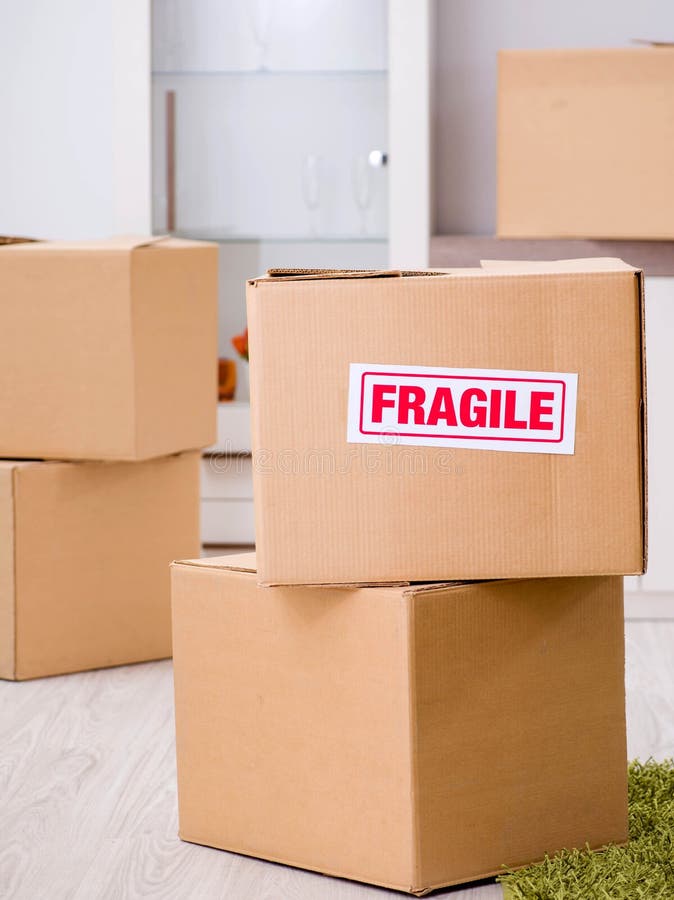 Man Moving House and Relocating with Fragile Items Stock Photo - Image ...