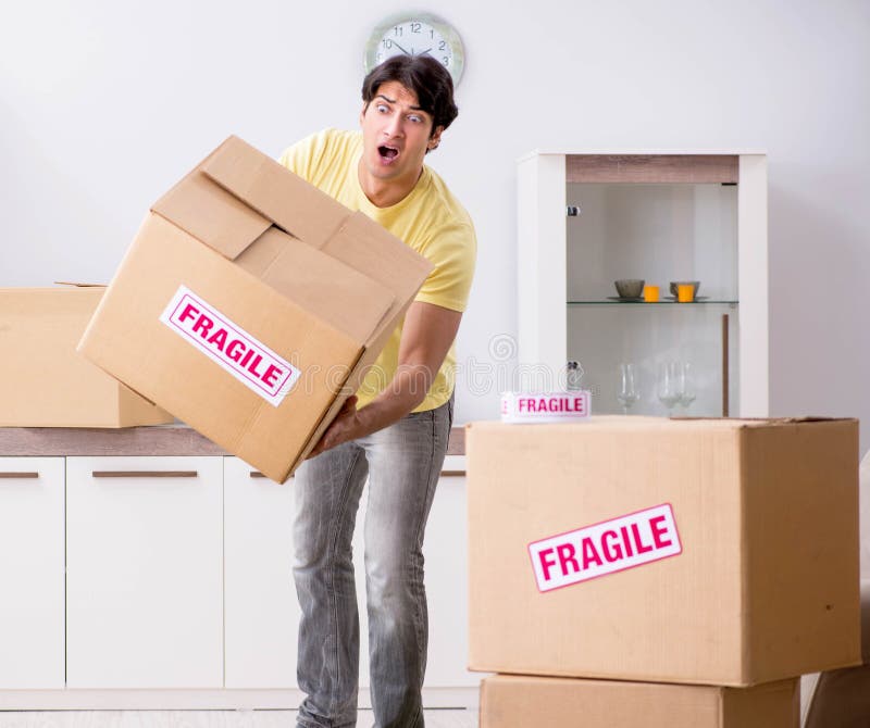 Man Moving House and Relocating with Fragile Items Stock Image - Image ...