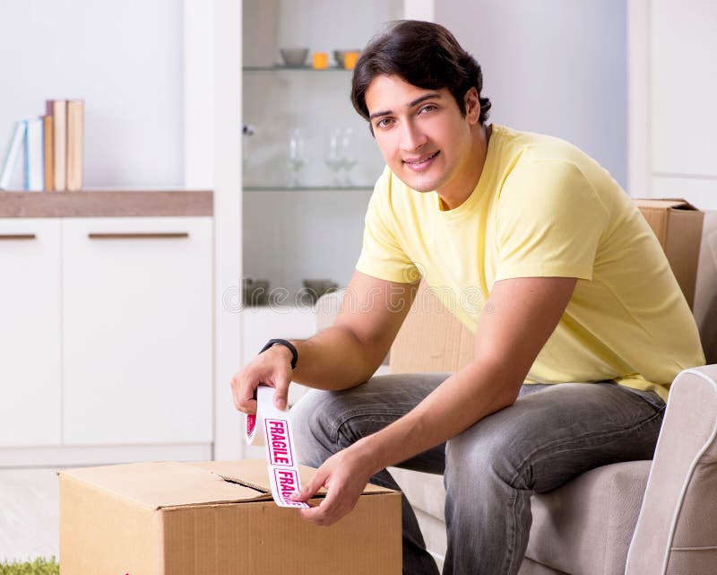 Man Moving House and Relocating with Fragile Items Stock Photo - Image ...