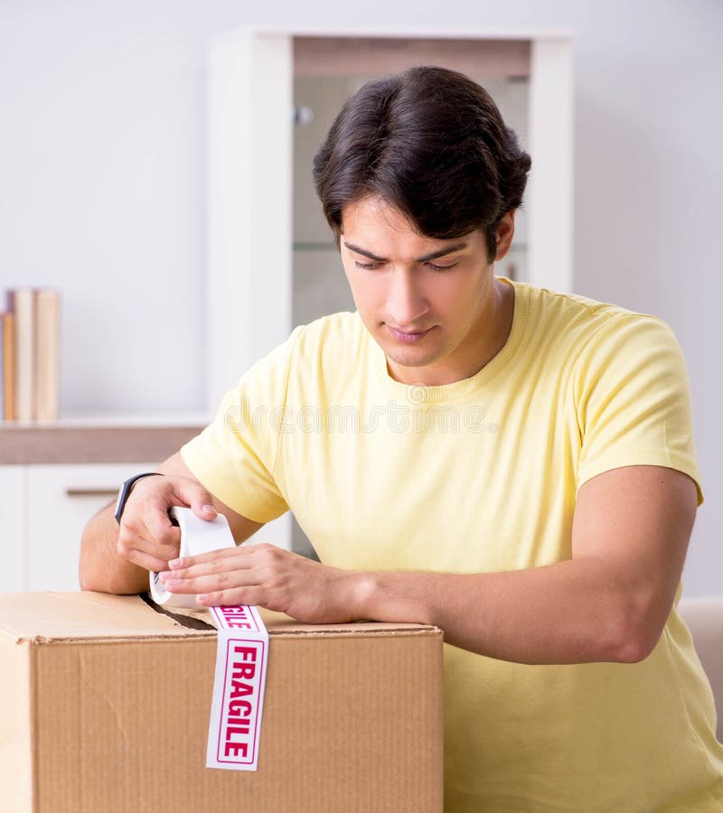 Man Moving House and Relocating with Fragile Items Stock Image - Image ...