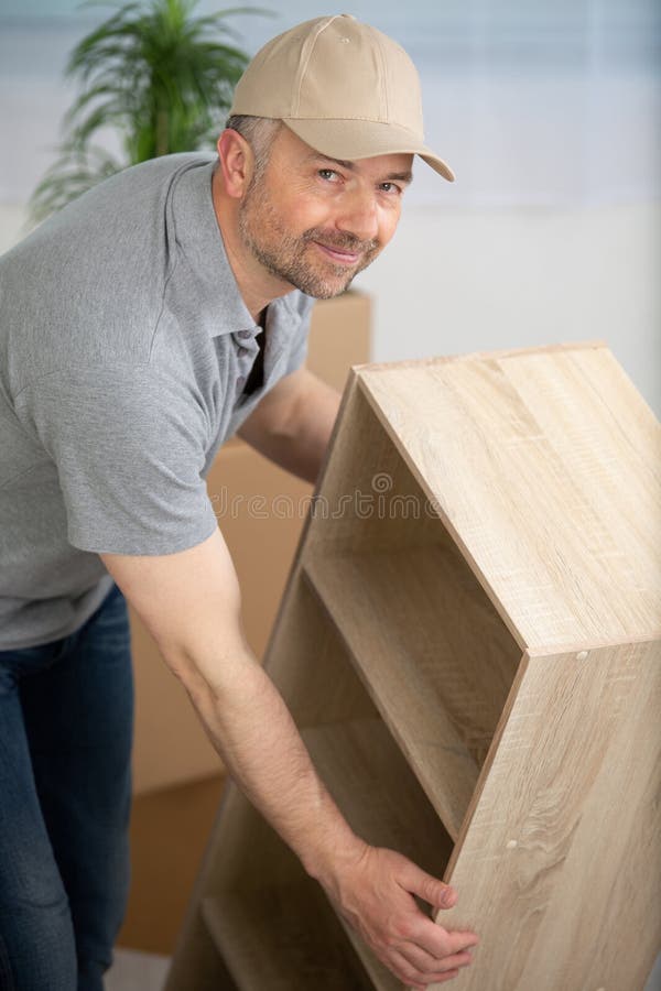 Man moving into new home stock image. Image of wood - 276072871