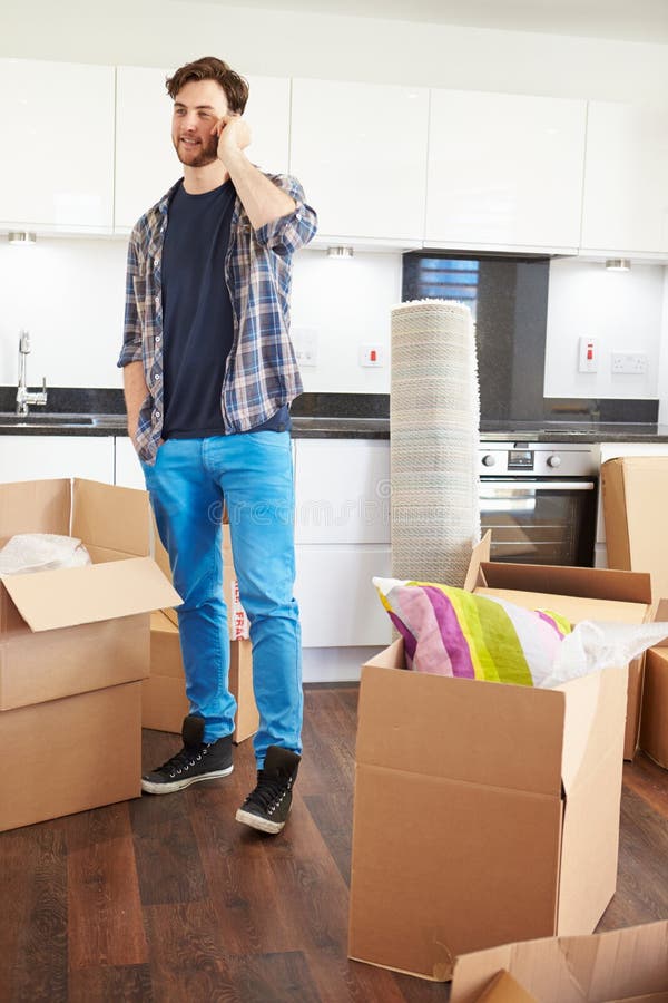 Man Moving into New Home Talking on Mobile Phone Stock Image - Image of ...