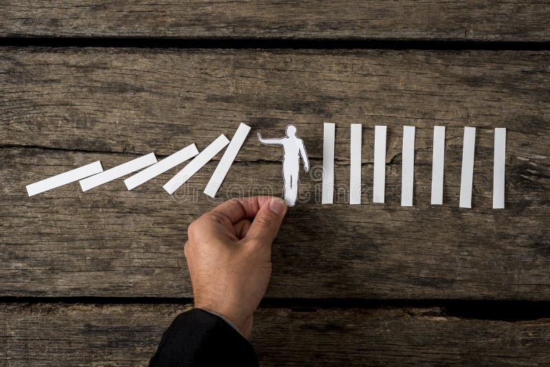 Man Moving Small White Flat Figure on Wood Stock Photo - Image of paper ...