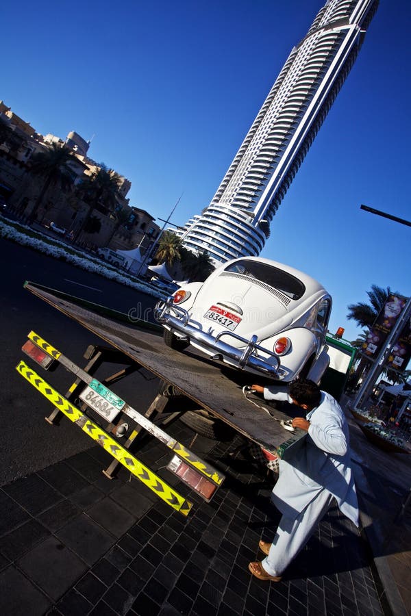 A man moving a vehicle. editorial stock image. Image of automobile ...