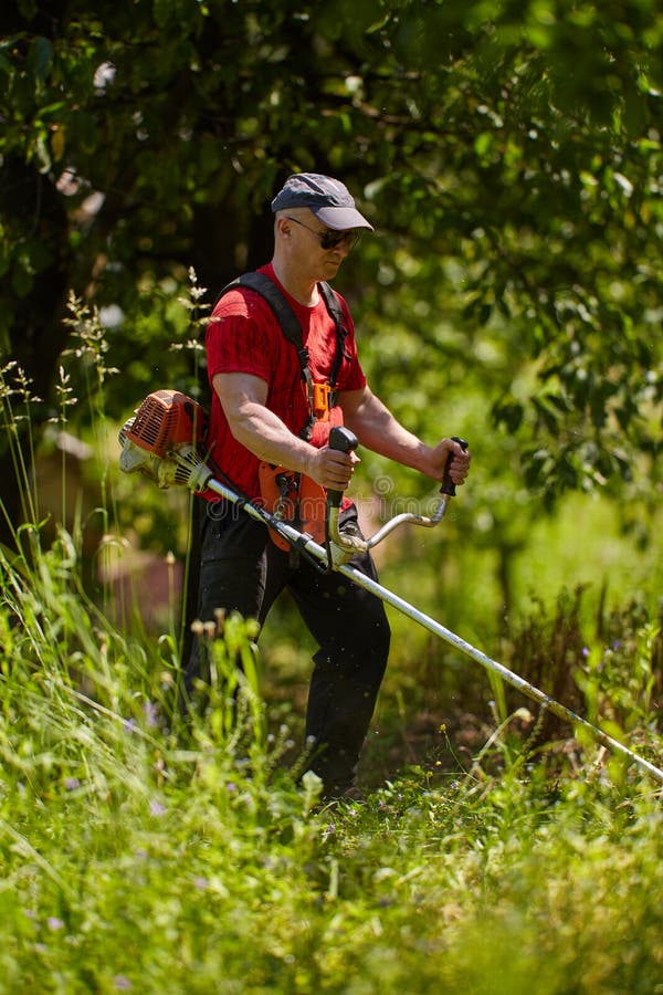 Man mowing his lawn stock image. Image of brush, farmer - 150778875