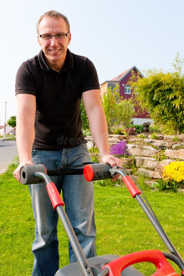Man mowing lawn stock photo. Image of work, yard, garden - 15584136