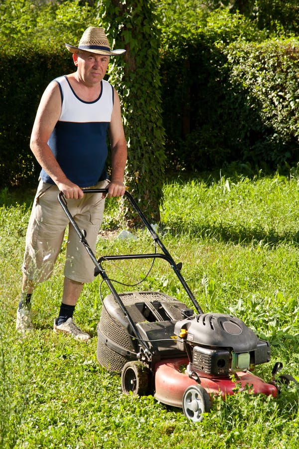 Man mowing the lawn stock image. Image of lawnmower, field - 20033403
