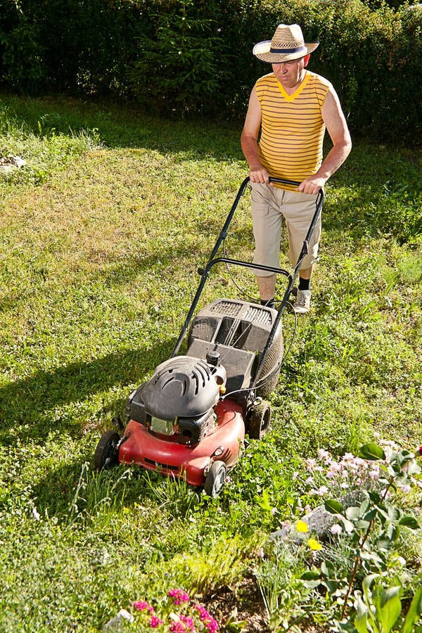 Man Mowing The Lawn Stock Photos - Image: 20138313