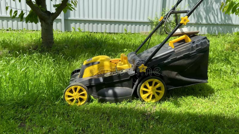 A Man Mows the Grass with a Lawn Mower Stock Video - Video of worker ...