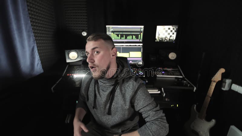 Man in Music Studio, Young Man Engaging with Music Equipment in a ...