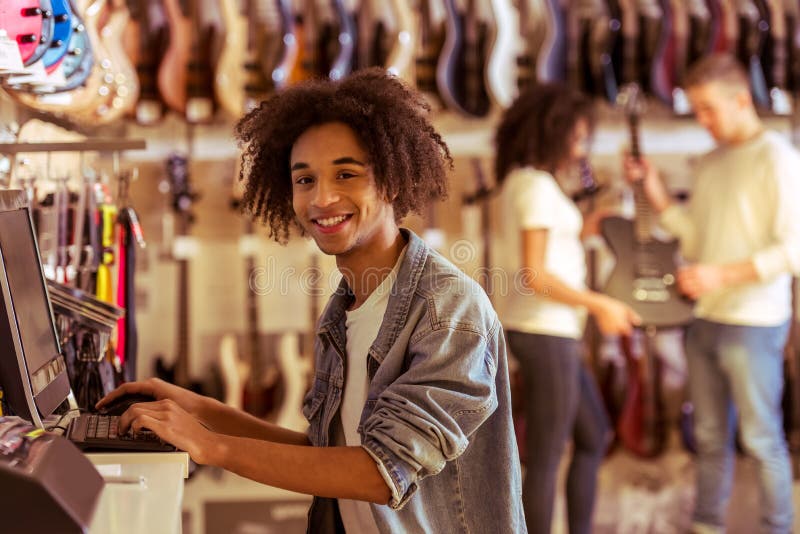 Man in musical shop stock image. Image of cashier, culture - 67403113