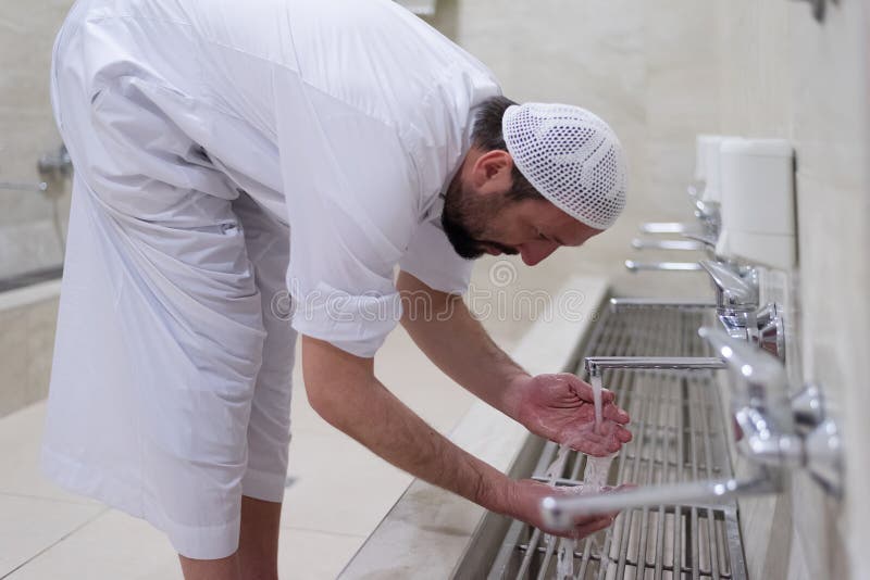 Man Muslim Perform Ablution or Wudu at the Mosque. Washing before Pray ...