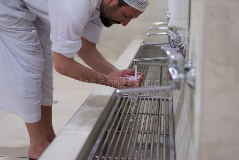 Man Muslim Perform Ablution or Wudu at the Mosque. Washing before Pray ...