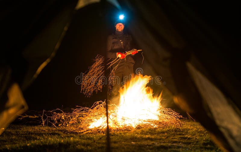 Man Near Camp Fire at Night Stock Photo - Image of dark, lantern: 39375720