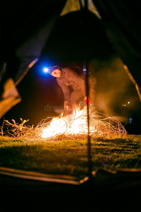 Man near camp fire stock image. Image of forest, campsite - 39375705
