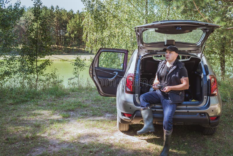 Man Near a Car in Nature. Rest at Nature. Camping by Car Stock Photo ...