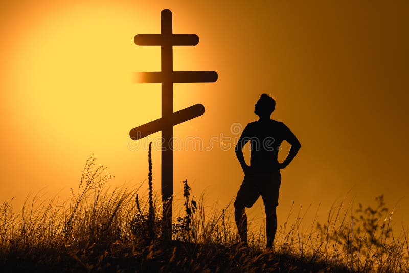 Man Near Orthodox Cross on the Background of the Sunset Stock Photo ...