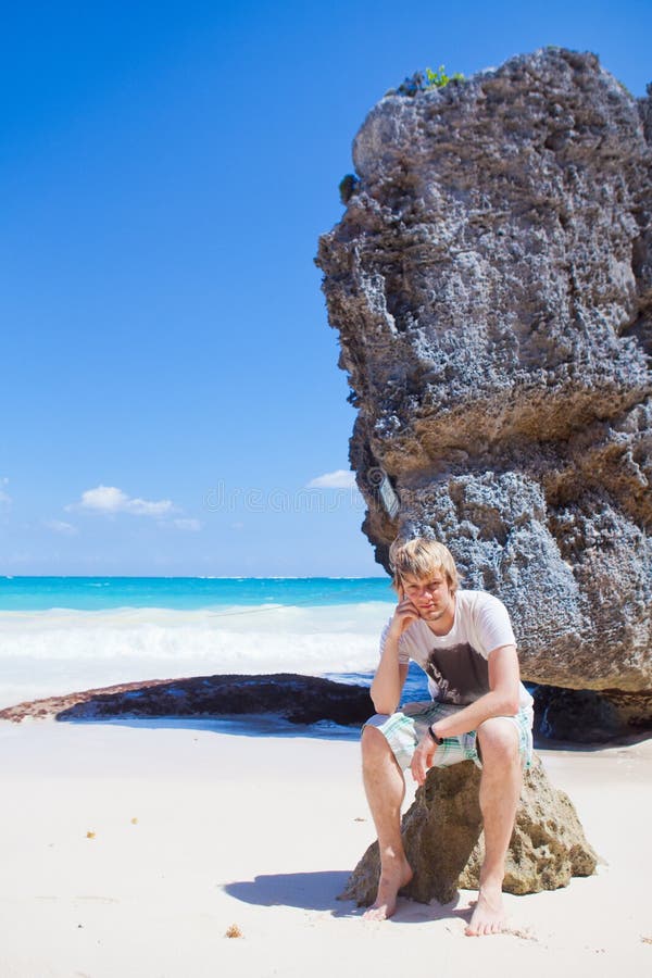 Man near the sea stock image. Image of water, waves, sitting - 27841209
