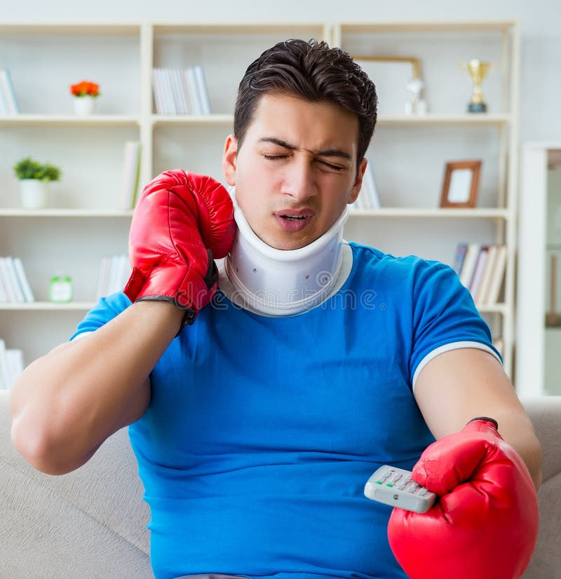 Man with Neck Injury Watching Boxing at Home Stock Photo - Image of ...