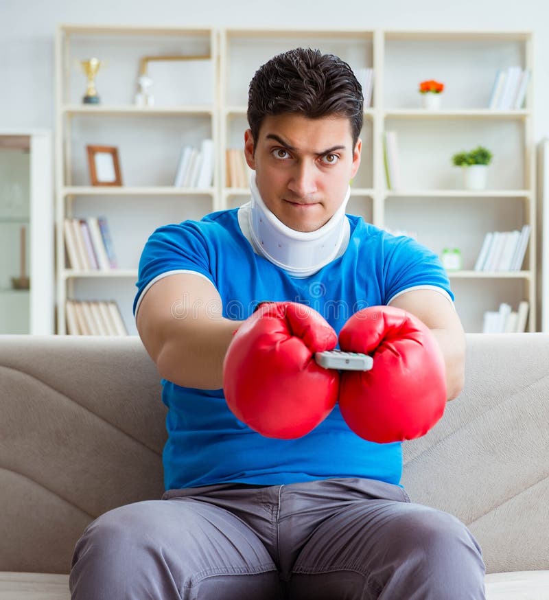 Man with Neck Injury Watching Boxing at Home Stock Image - Image of ...