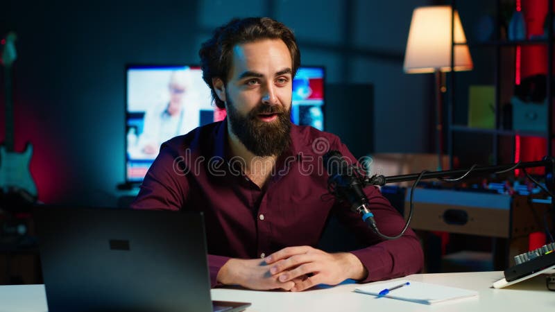 Man in Neon Lit Home Studio Using Equipment for Vlog Shooting, Stock ...