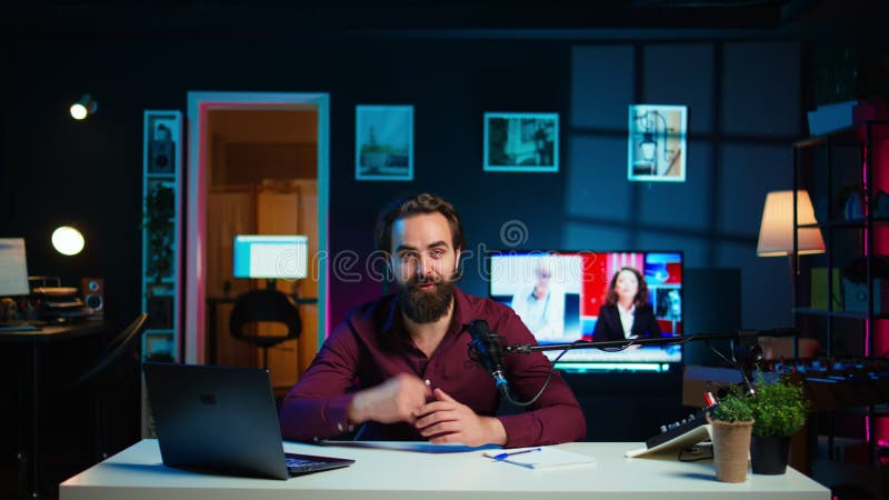 Man in Neon Lit Home Studio Using Equipment for Vlog Shooting, Stock ...