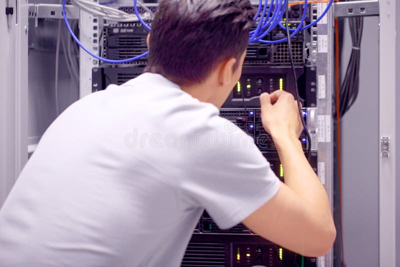 Man in network server room stock photo. Image of rack - 75792532