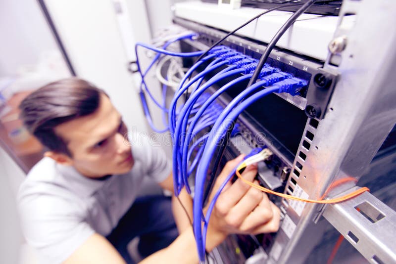Man in network server room stock photo. Image of system - 76082446
