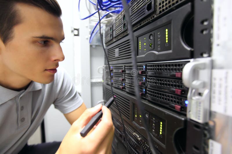 Man in network server room stock photo. Image of professional - 76729550