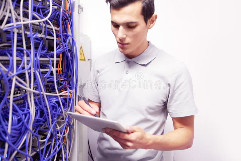 Man in network server room stock image. Image of engineer - 75151105