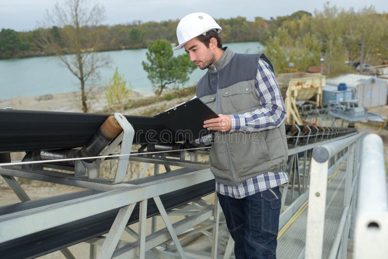 Man Next To Elevator in Quarry Stock Photo - Image of mineral ...