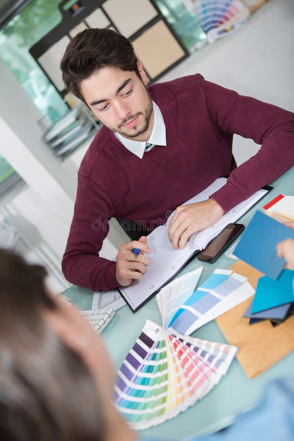 Man with Notebook and Paint Charts Stock Photo - Image of guide ...