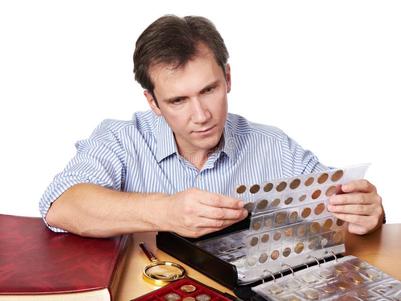 Man Numismatist Examines His Collection of Coin Stock Image - Image of ...