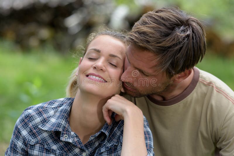 Man Nuzzling Girlfriends Ear Stock Image - Image of darling, emotions ...