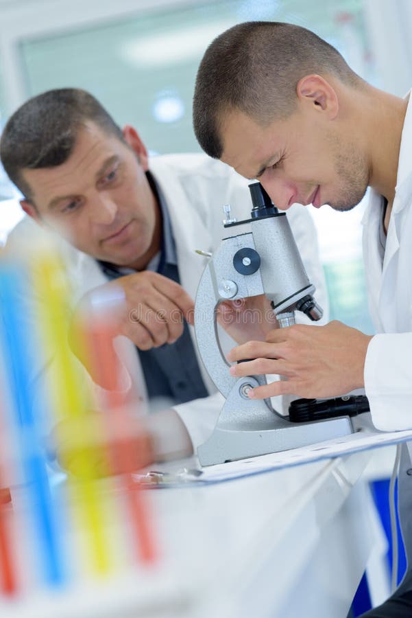 Man Observing Something Under Microscope Stock Image - Image of lens ...